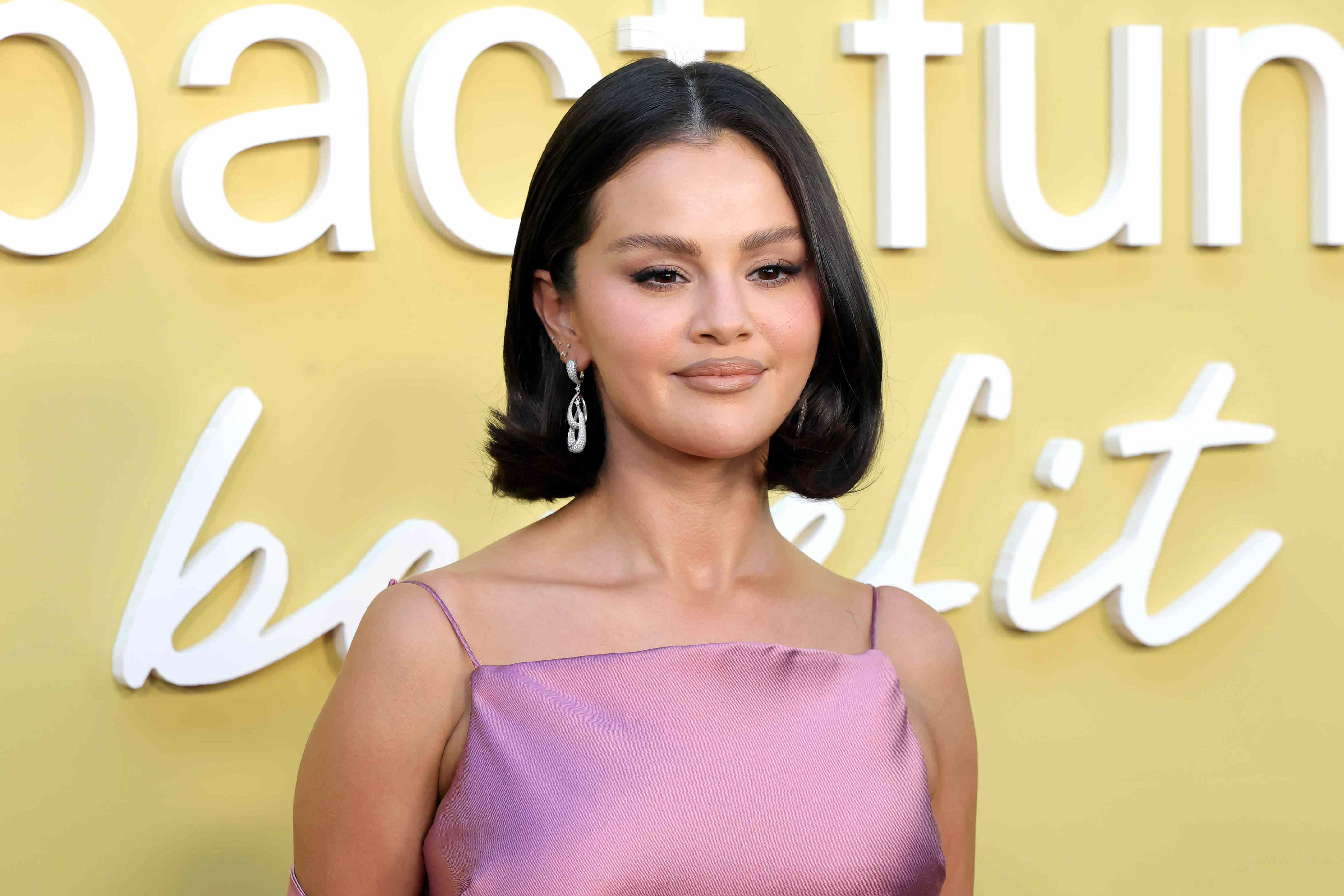 Selena Gomez pairs her low-cut dress with new haircut and deep ...