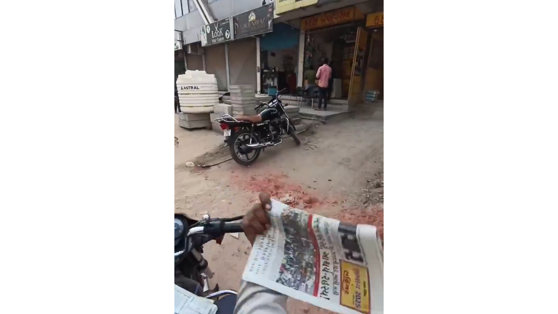 Paper boy has mastered his job!