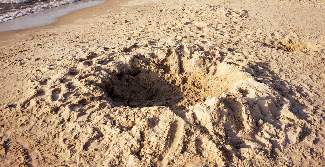 Two teens die after being buried alive when sand hole they dug collapsed