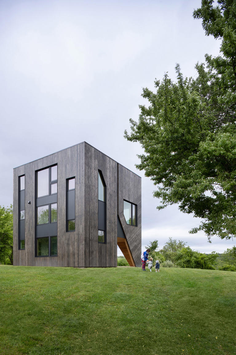Forma lifts Hudson Valley cedar-clad house on angled legs