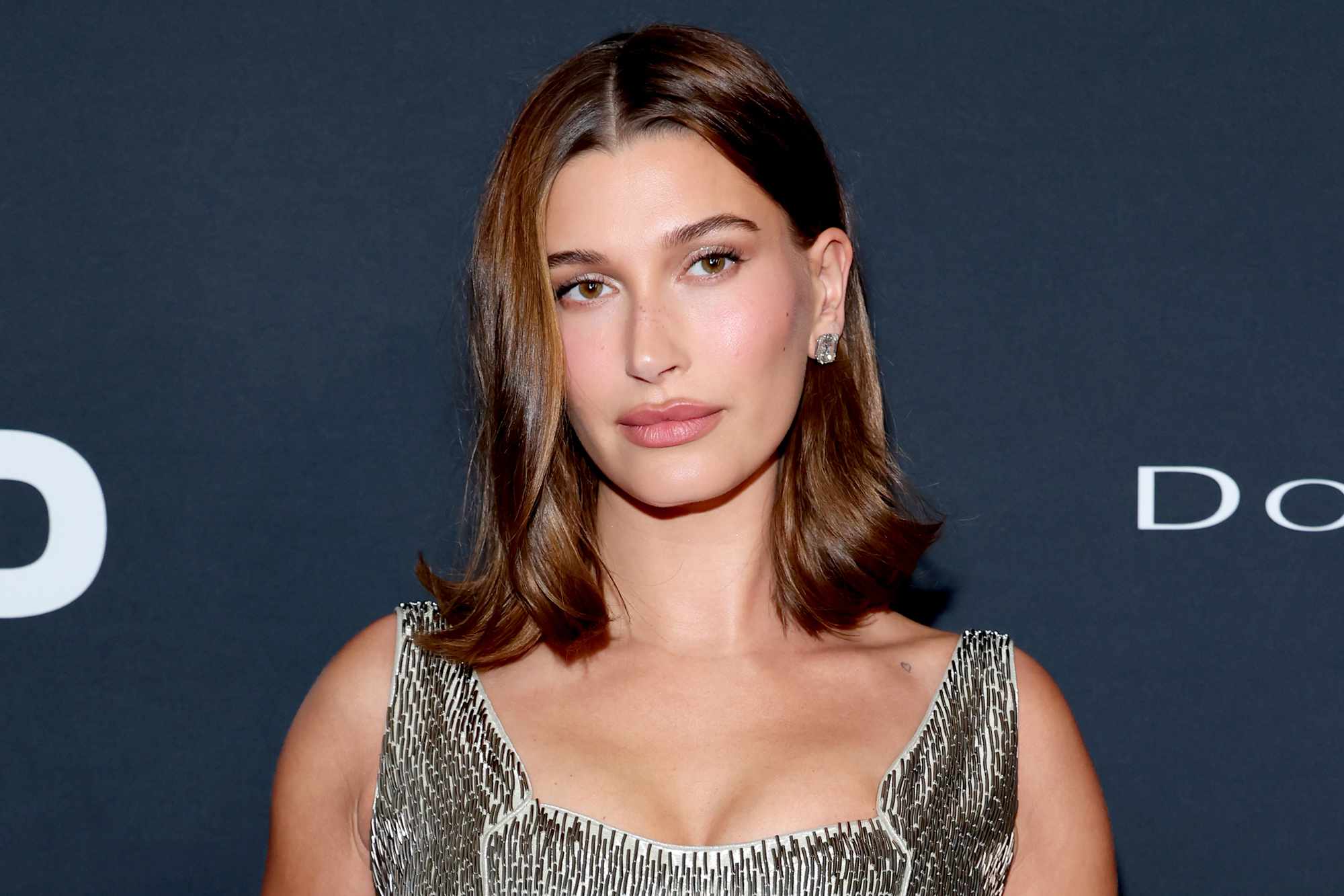 Hailey Bieber shows off new rib tattoo that's seemingly in honor of 21 ...