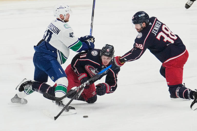 Blue Jackets beat skidding Canucks 4-1 behind Marchenko and Johnson