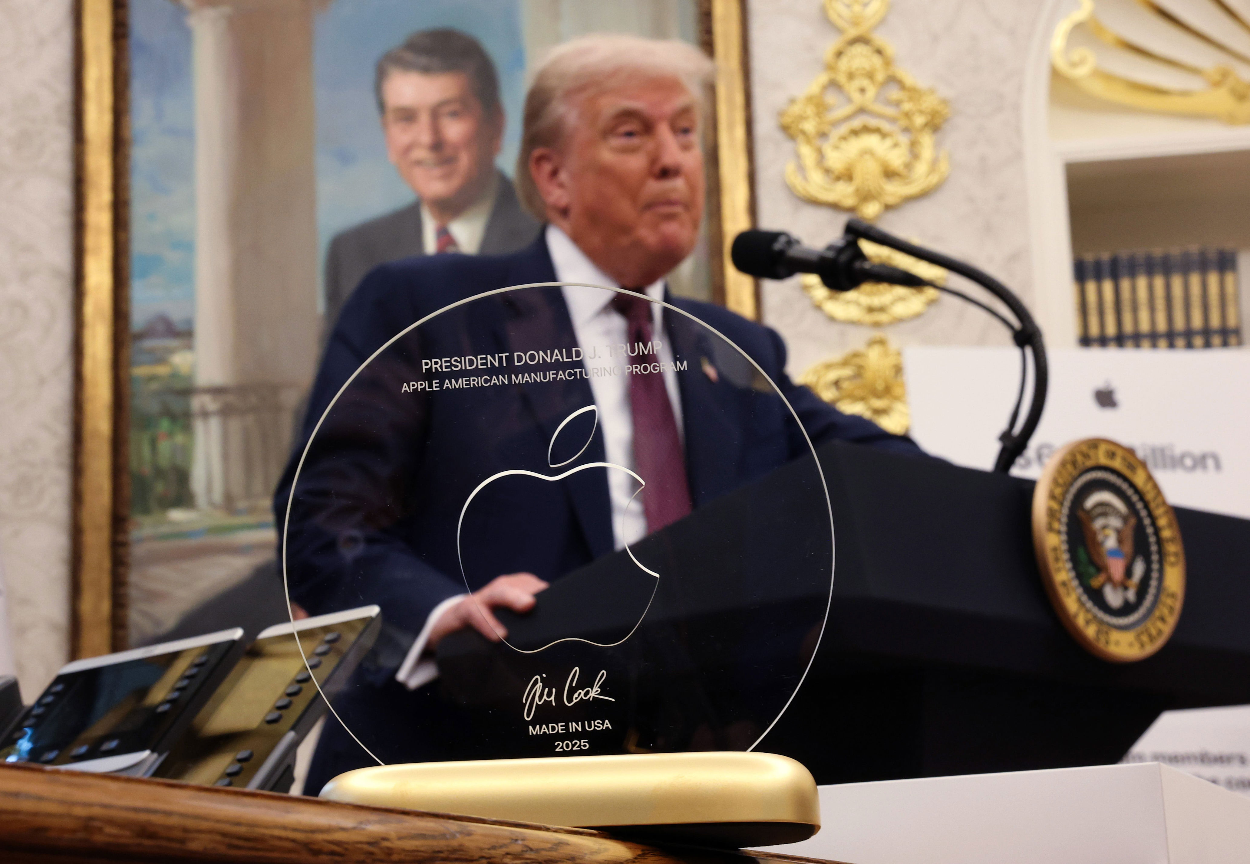 Trump accepts golden hockey stick adding to tacky collection
