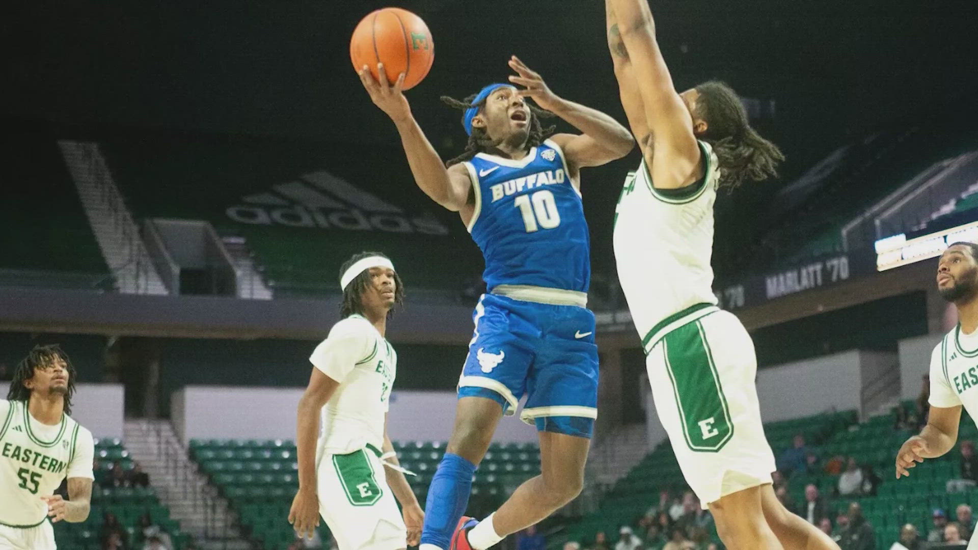 Former UB player charged in betting scheme