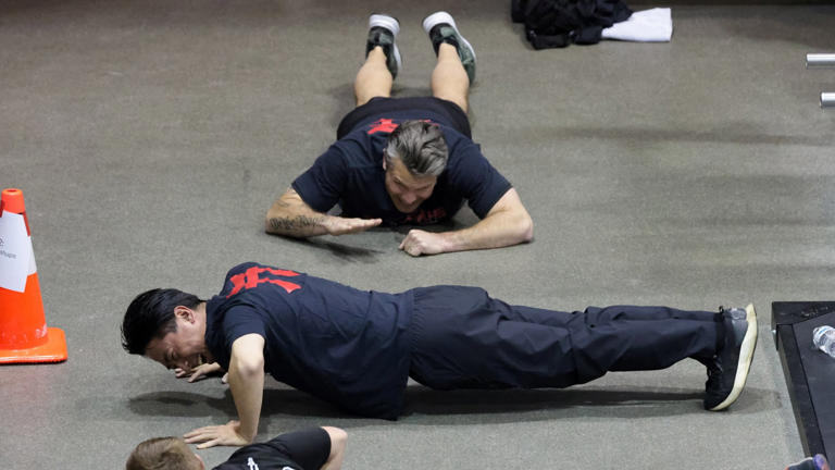 US and Japan defense chiefs show alliance with dawn push-ups