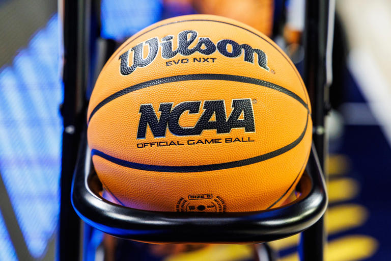 Former Rogers basketball player charged in NCAA betting scheme