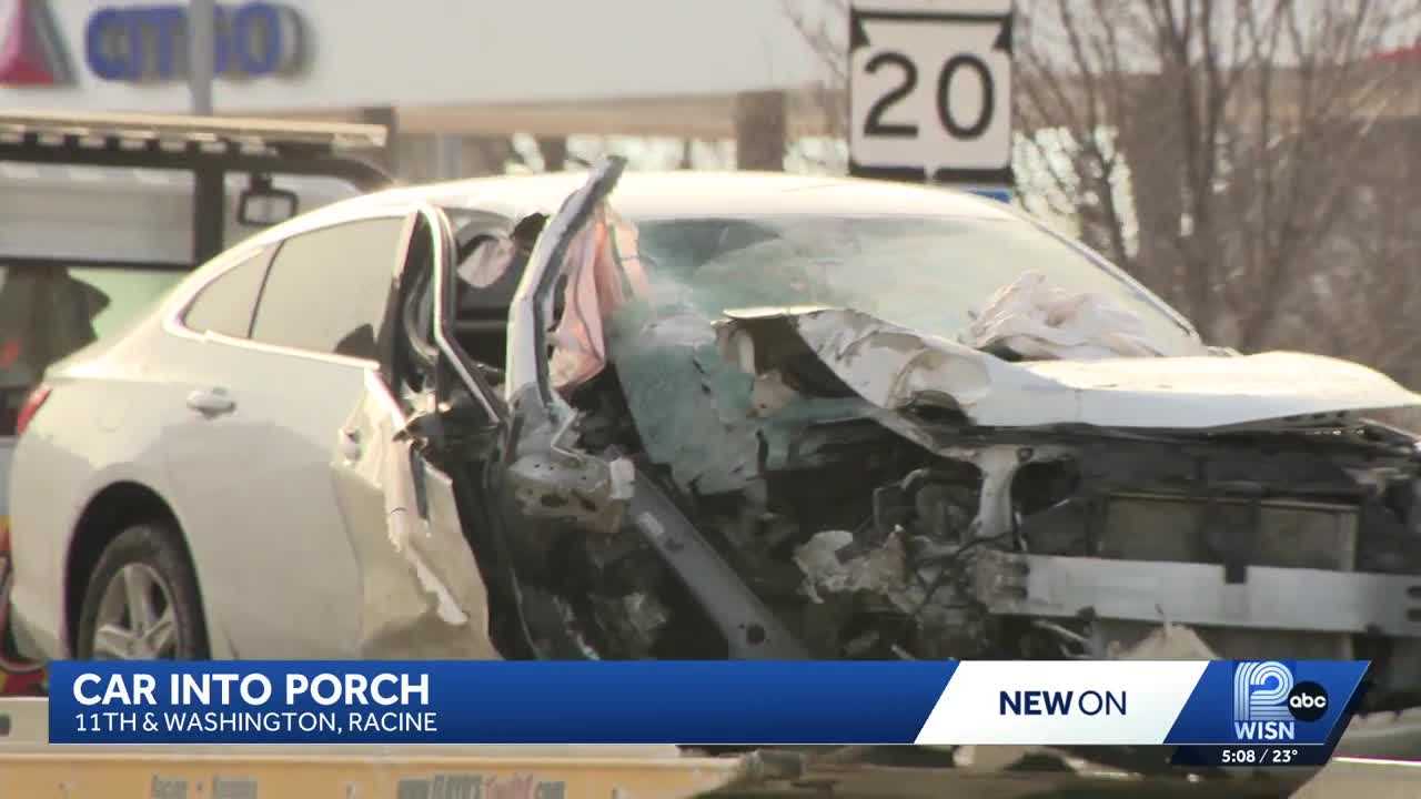 Car hits sign, porch in Racine