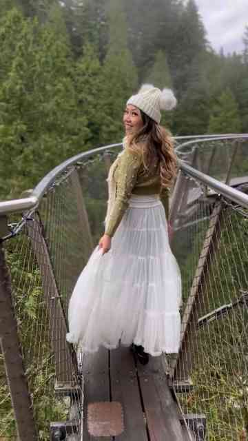 Magical walk on a suspension bridge in the forest