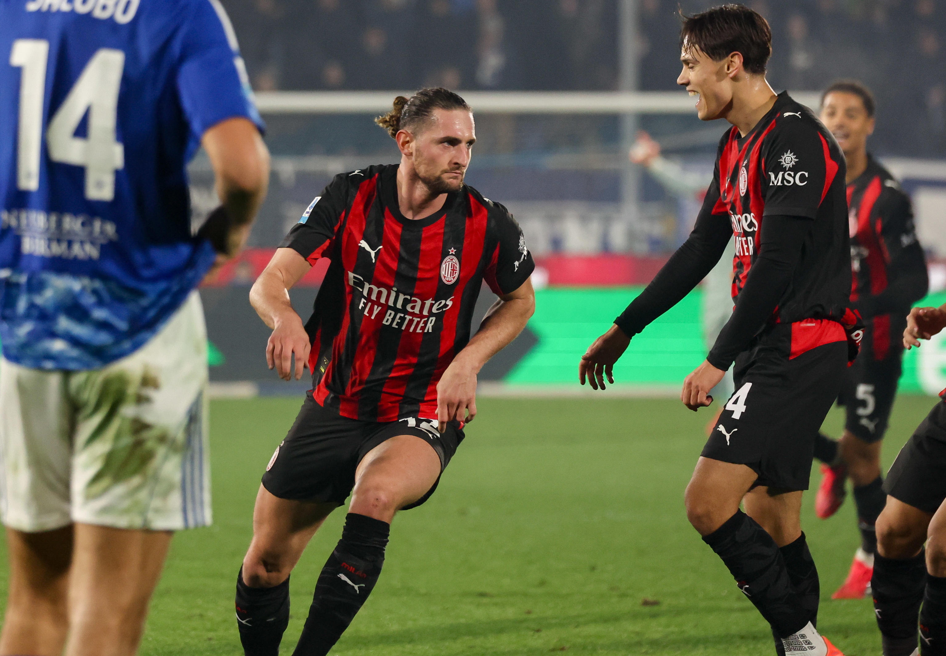 Soccer: Milan keep up title chase with 3-1 win at Como