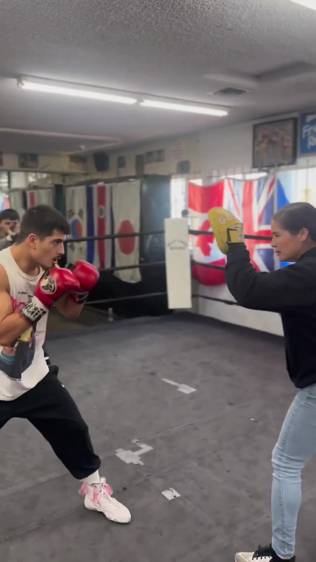 Alan Garcia firing laser sharp punches while working pads with Coach Gee
