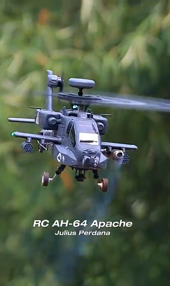 Apache RC helicopter firing rockets in action