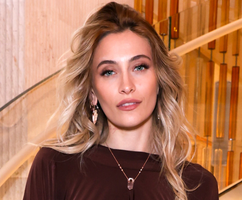 Paris Jackson stuns in slinky brown minidress and gold heels