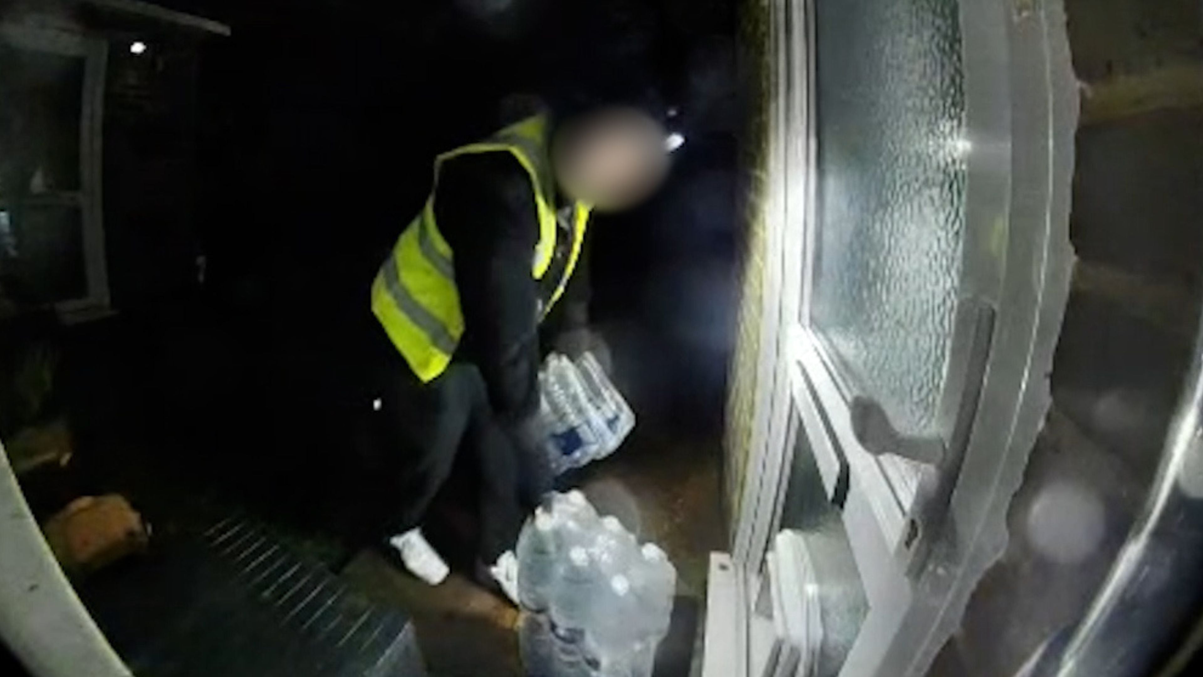 Delivery man caught on Ring camera removing emergency water bottles ...