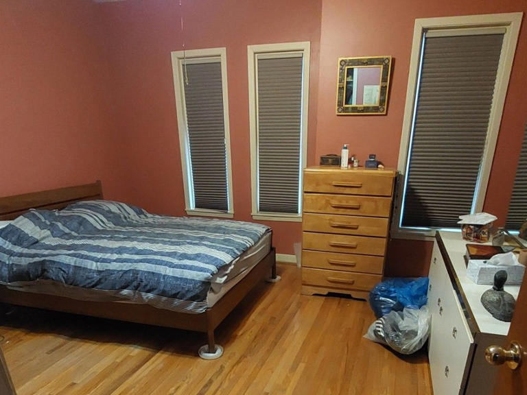 Weekend decorator: Built-in storage ties this mismatched bedroom together
