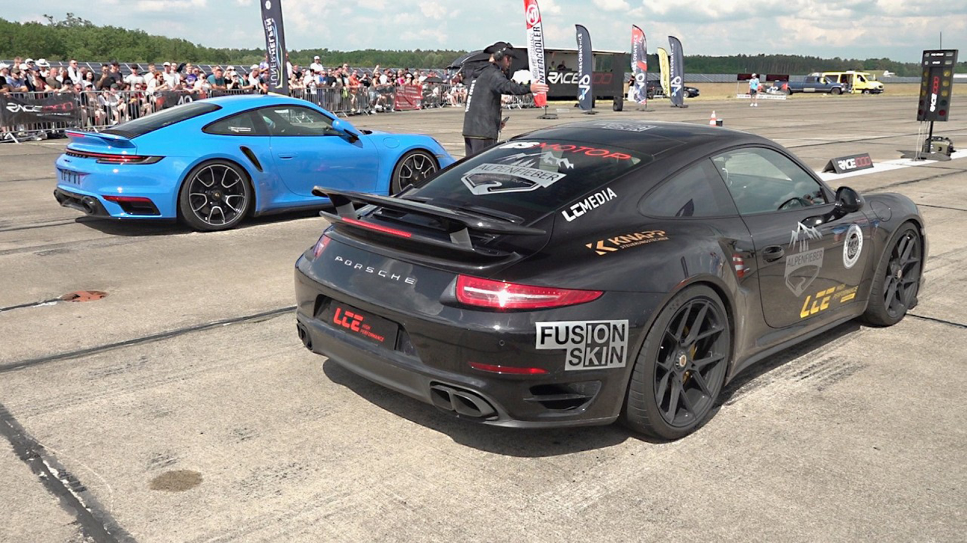 Modified sports cars face off in drag race