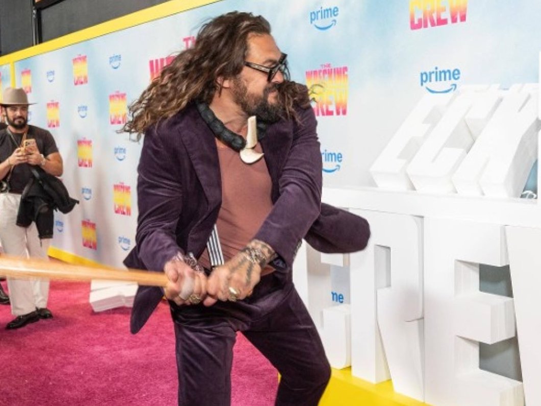On the red carpet: Jason Momoa smashes movie logo