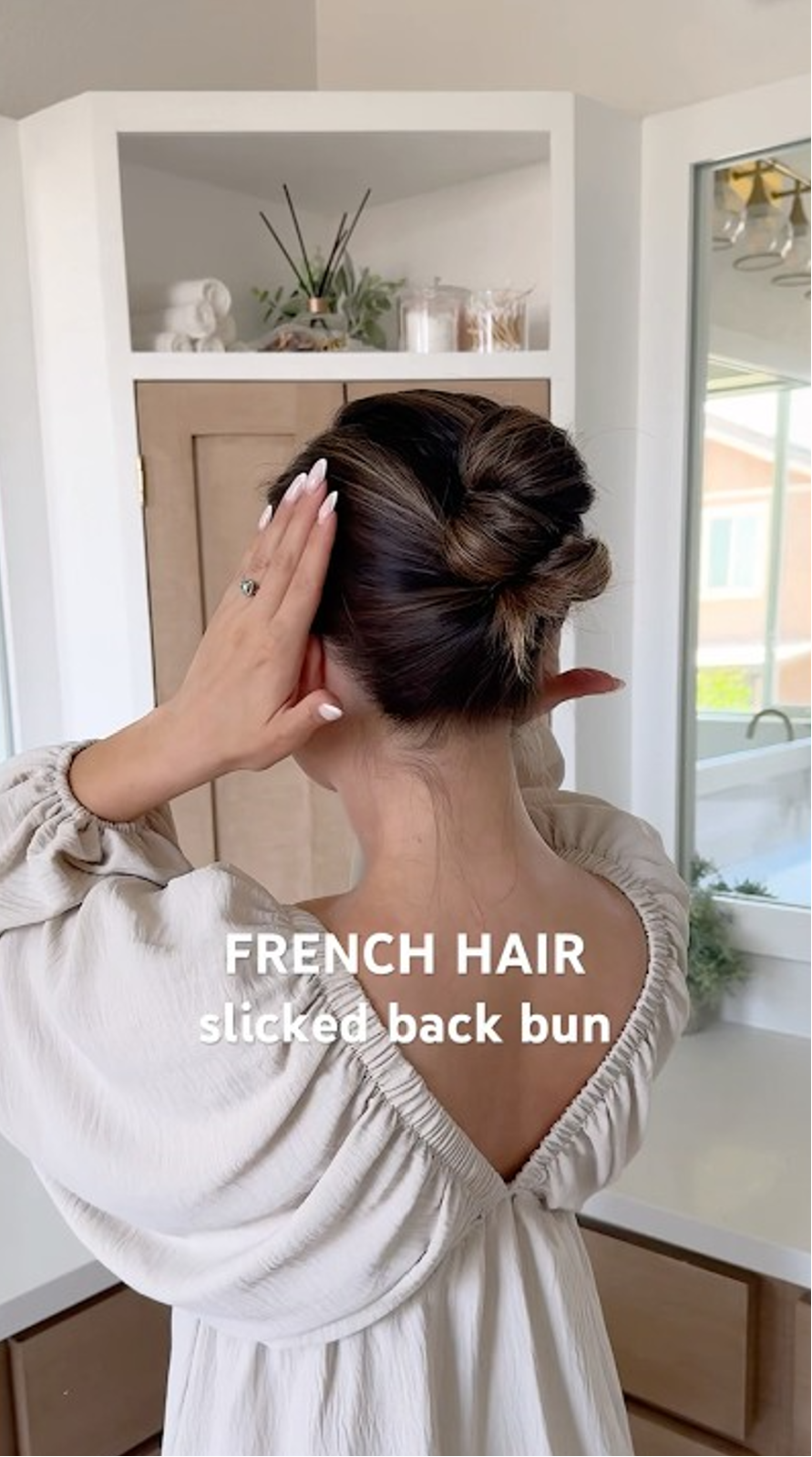 French pin slicked back bun hairstyle