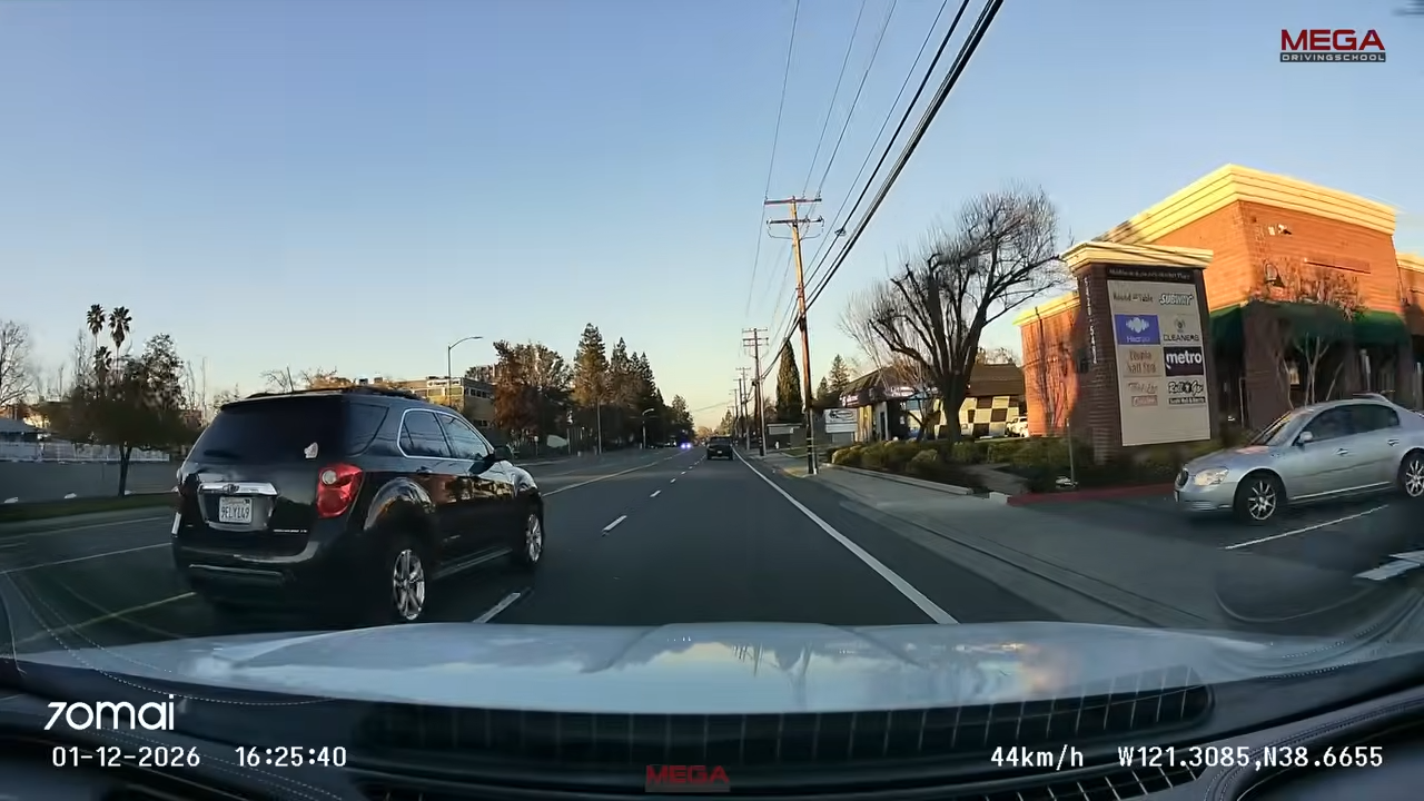 SUV pulls into traffic without a blinker or checking over their shoulder