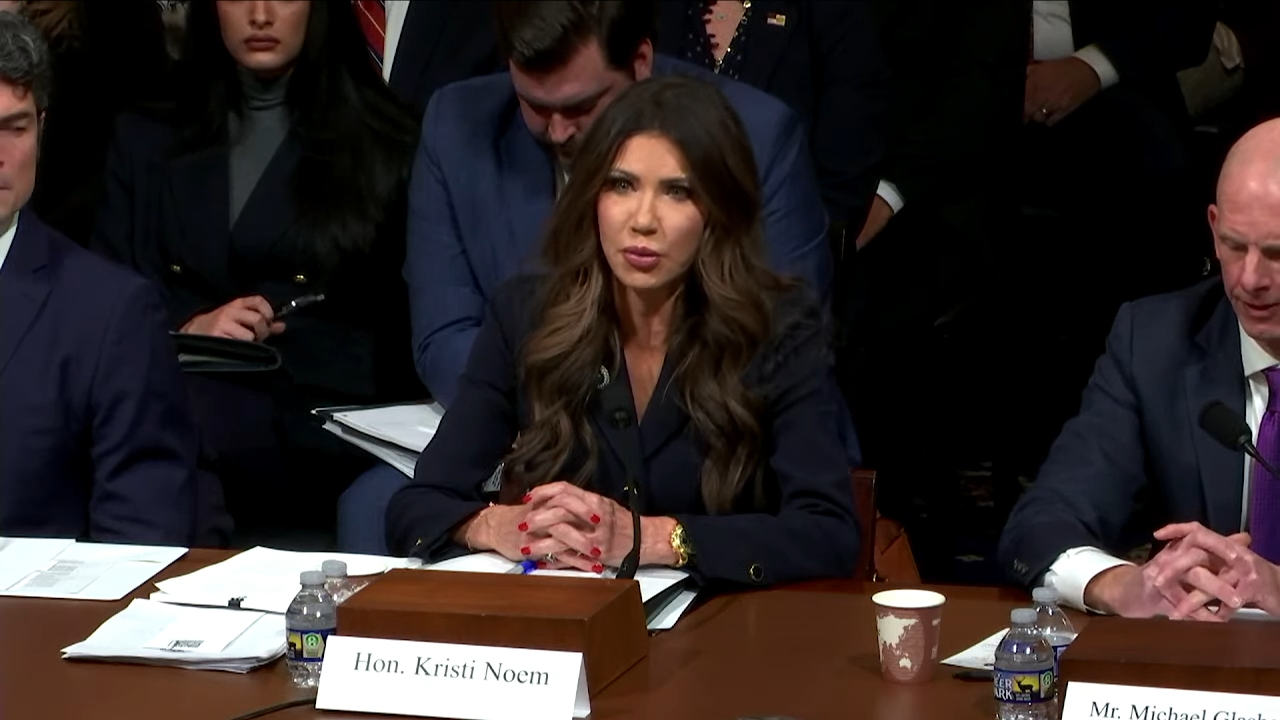 'That's his father': Kristi Noem shrinks back in her seat as she's ...