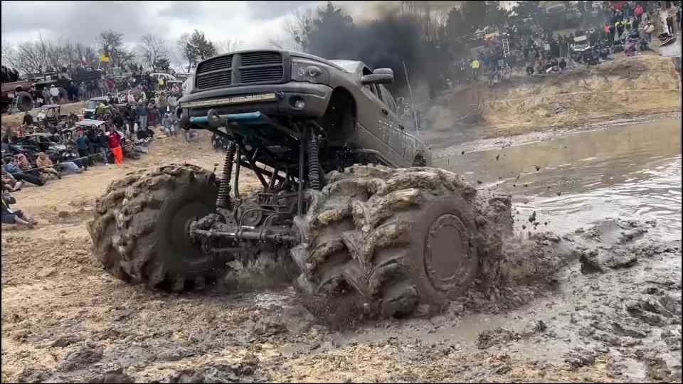 Mega trucks attempt impossible mud pit