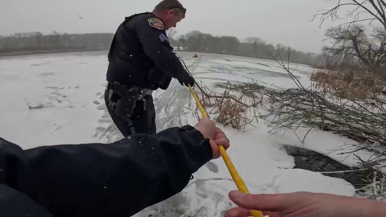 Michigan police rescue fisherman who fell through ice