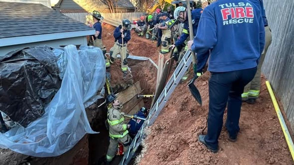Tulsa firefighters rescue man trapped in backyard trench collapse