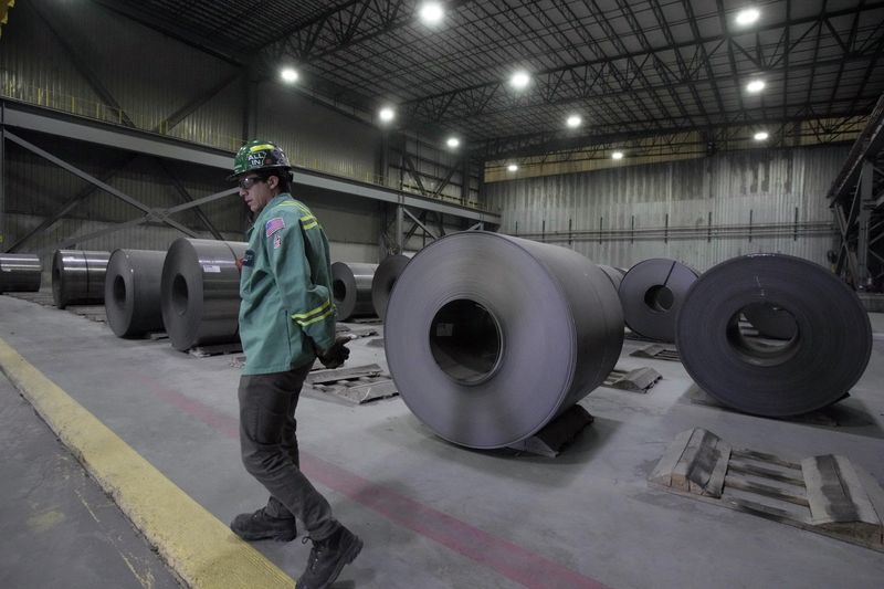 US manufacturing production rises on primary metals surge, outlook unclear