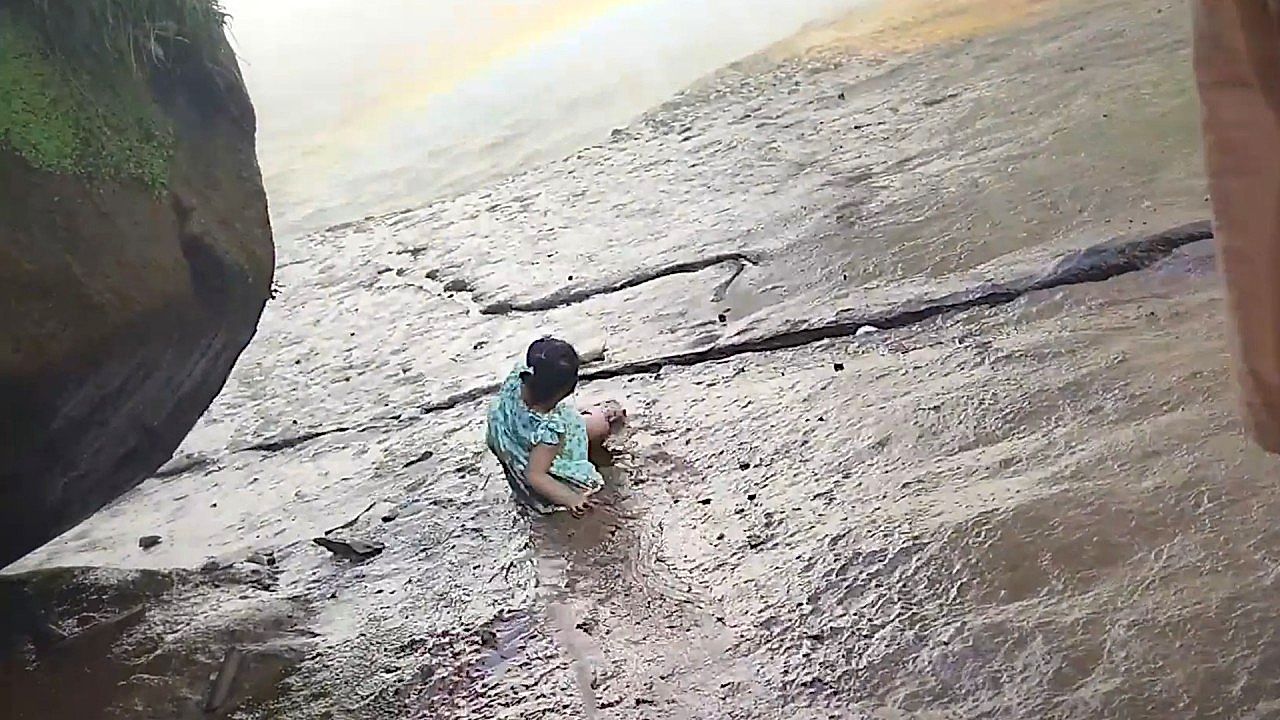 Toddler slips toward waterfall before last-second rescue