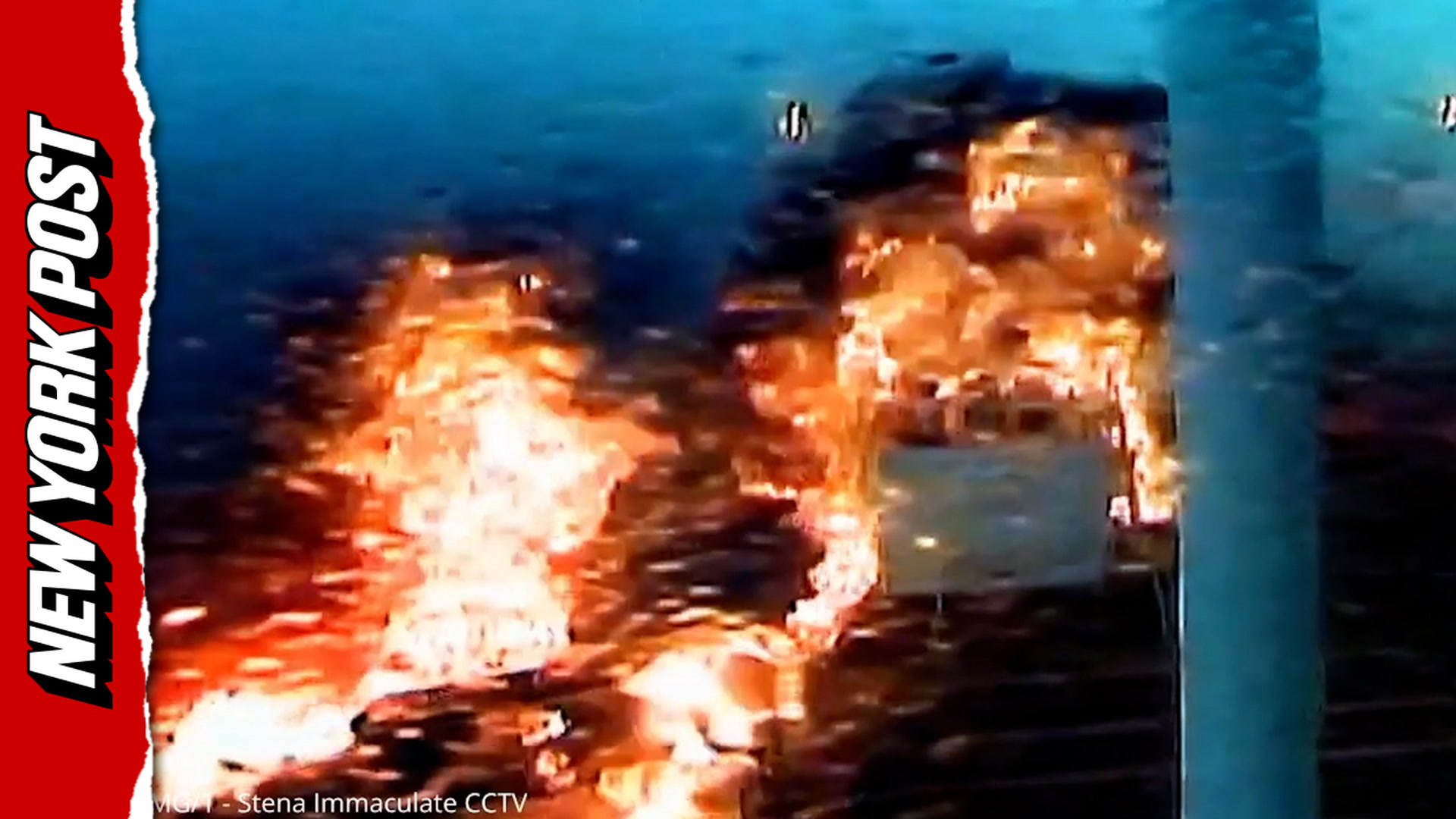 Moment huge flames erupt as container ship slams into oil tanker