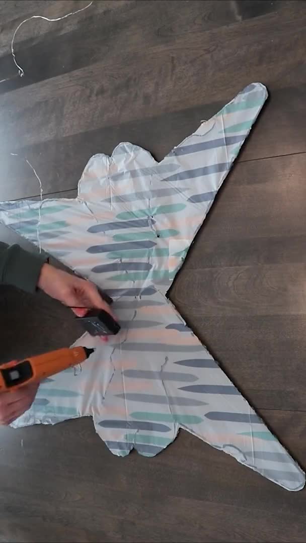 Lay a Dollar Tree hanger on a shower curtain...