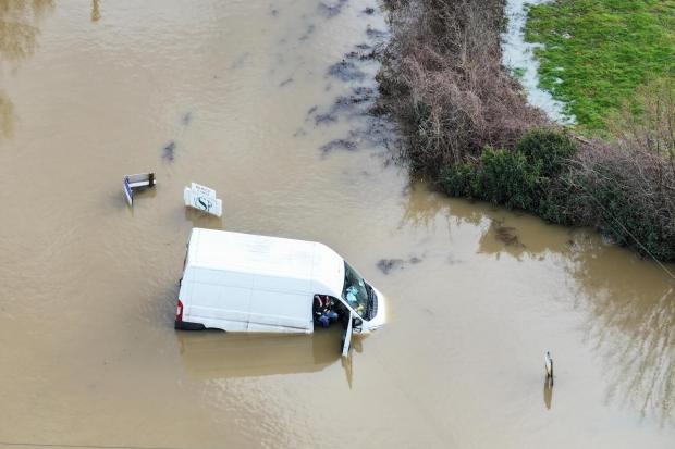 Driver rescued after van becomes stuck in flood water