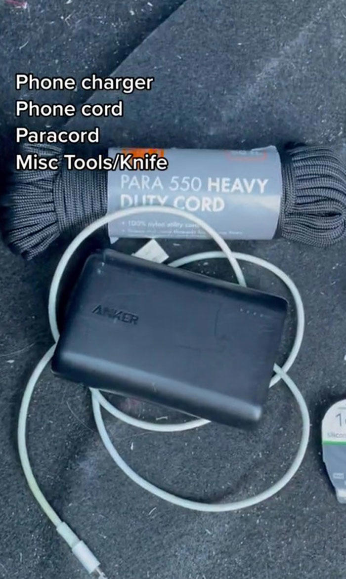 Survivalist Woman Essential Items Included In An Emergency Preparedness Kit