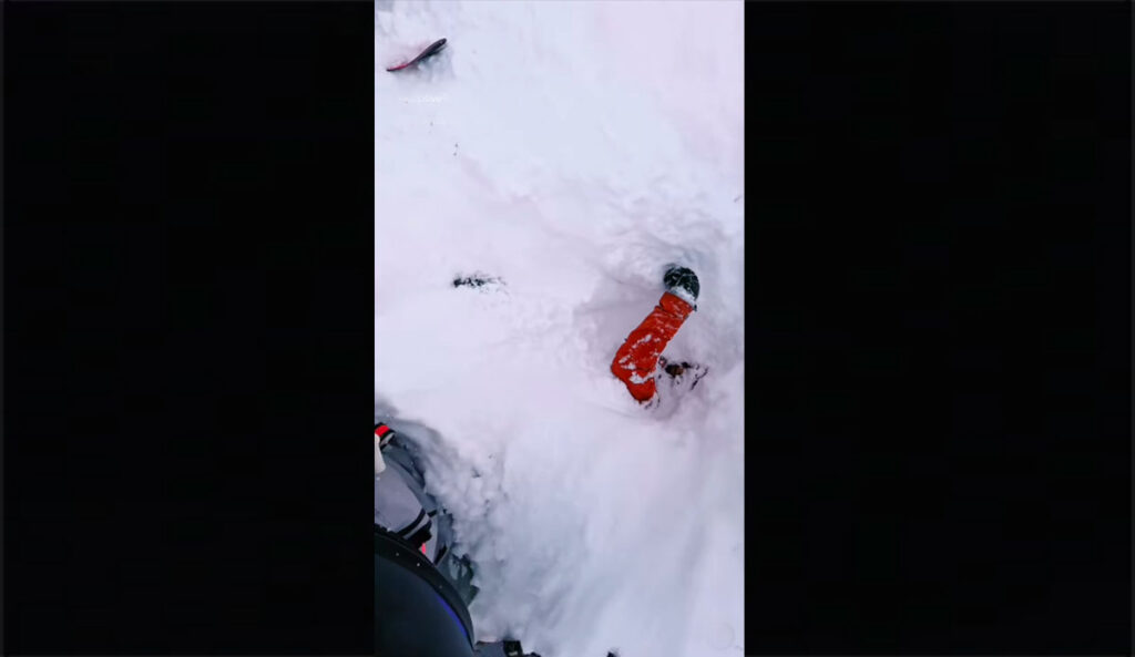 Watch terrifying moment when skier finds young boy buried in the snow