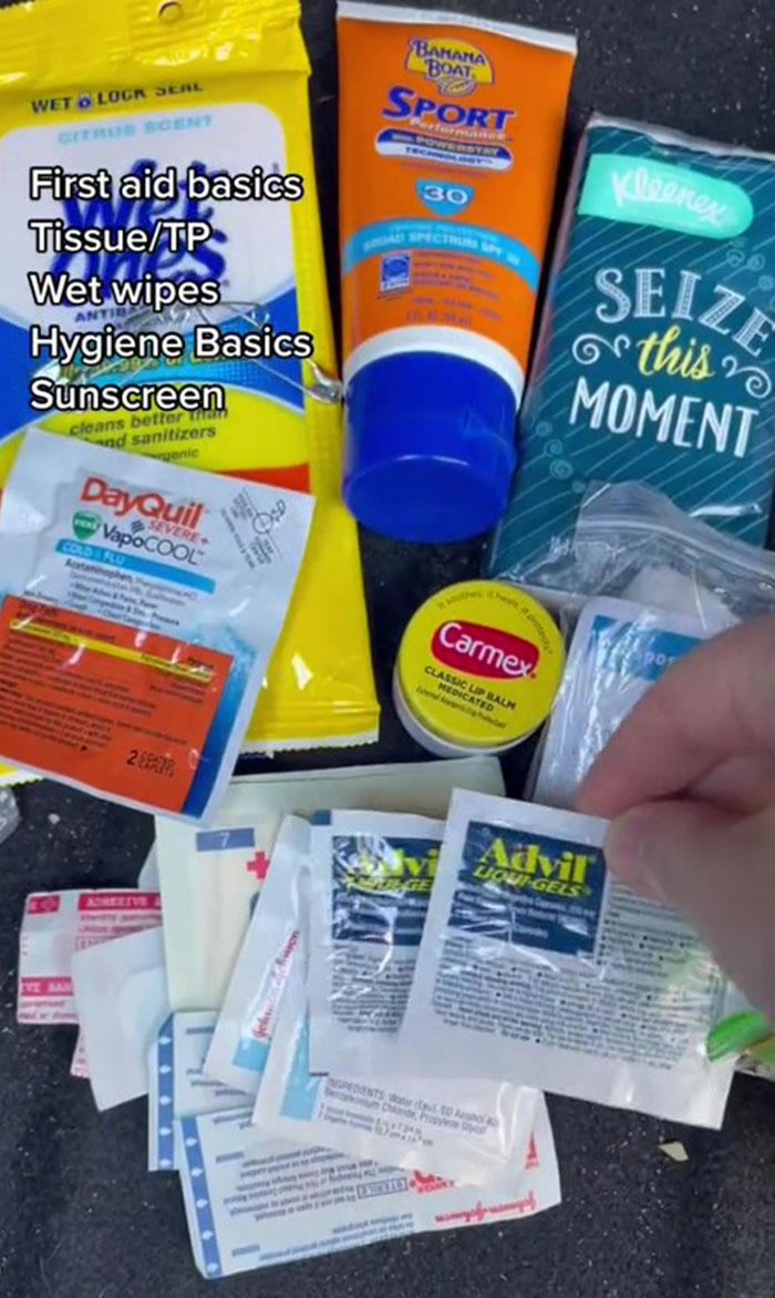 Survivalist Woman Essential Items Included In An Emergency Preparedness Kit