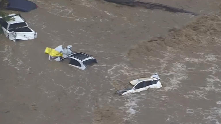 Dozens of cars swallowed by flash flooding in Victoria