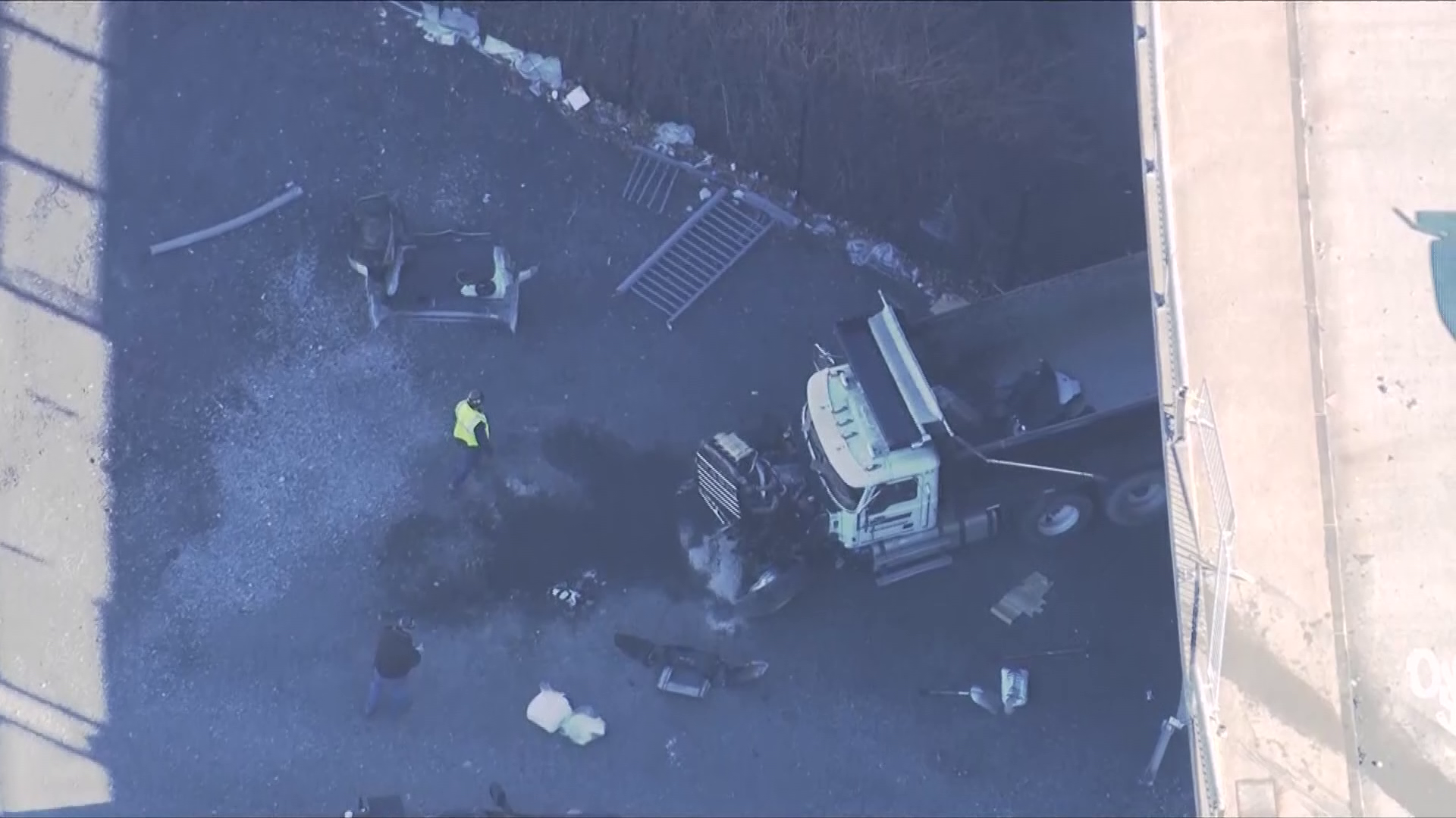 Two hurt after truck goes off Boston overpass onto ground below