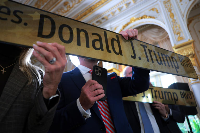 Trump unveils new street sign to help him find Mar-a-Lago