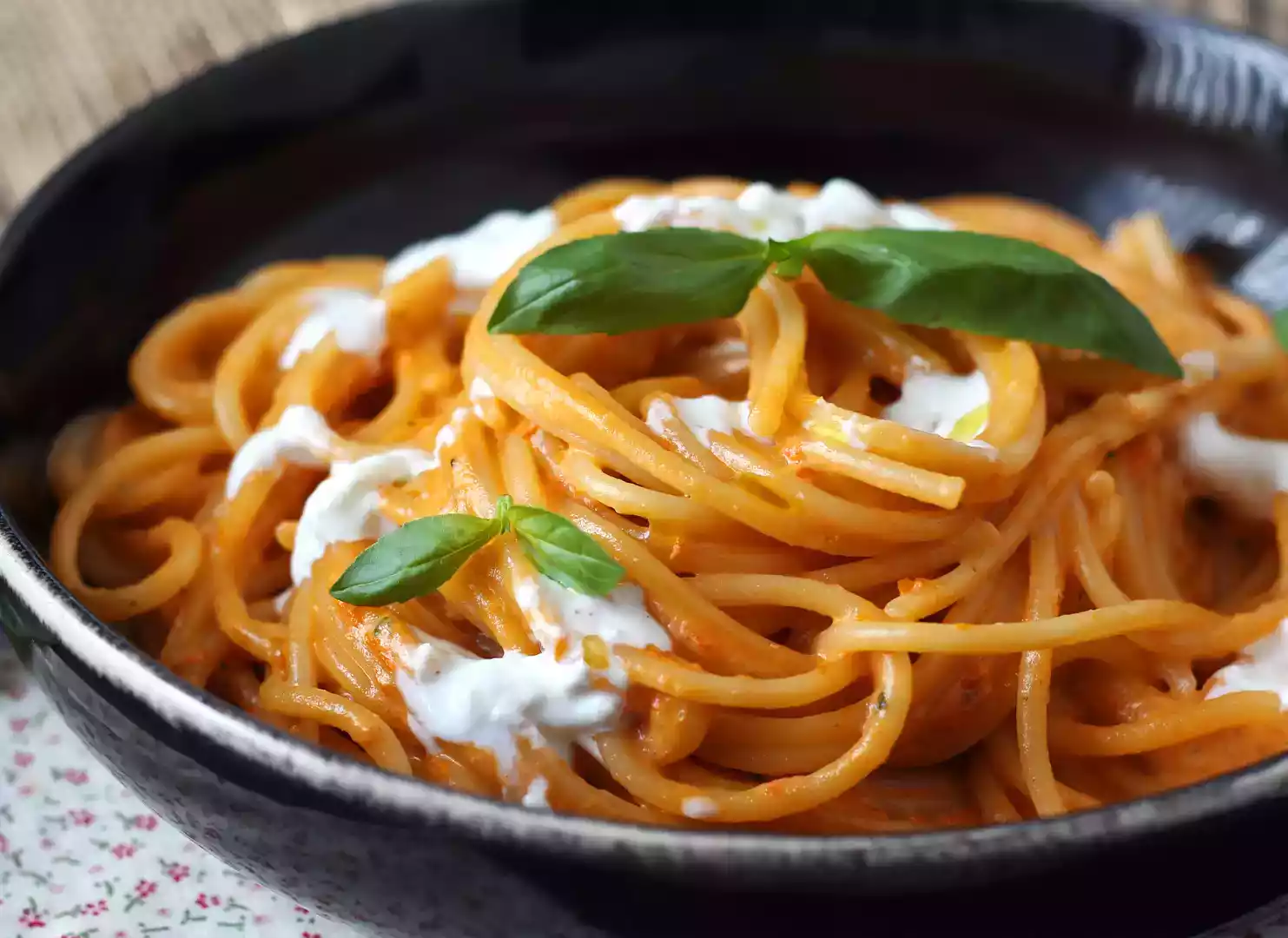 Creamy pasta with burrata cheese and cherry tomatoes