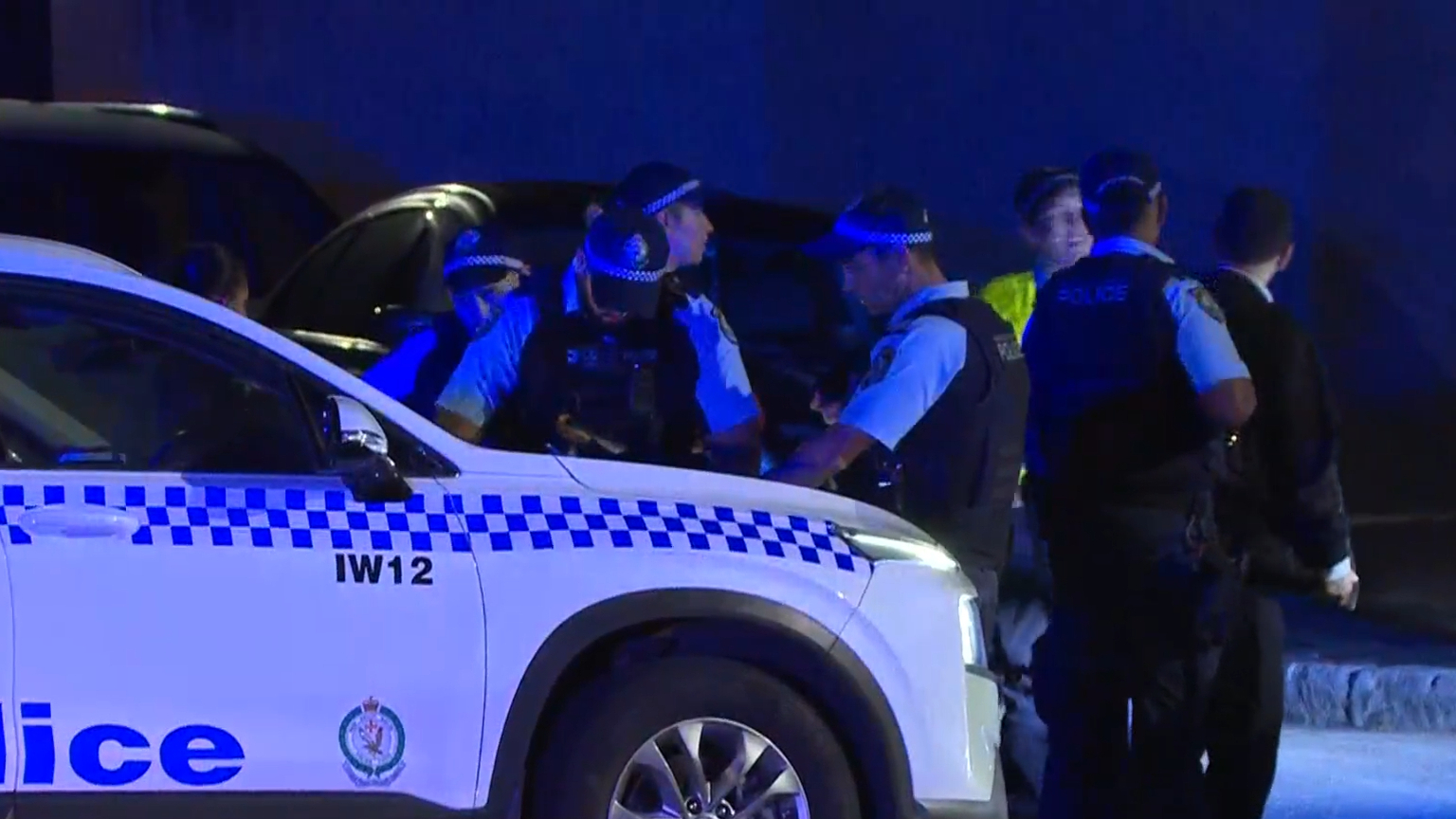Police officer wedged between two cars in Sydney