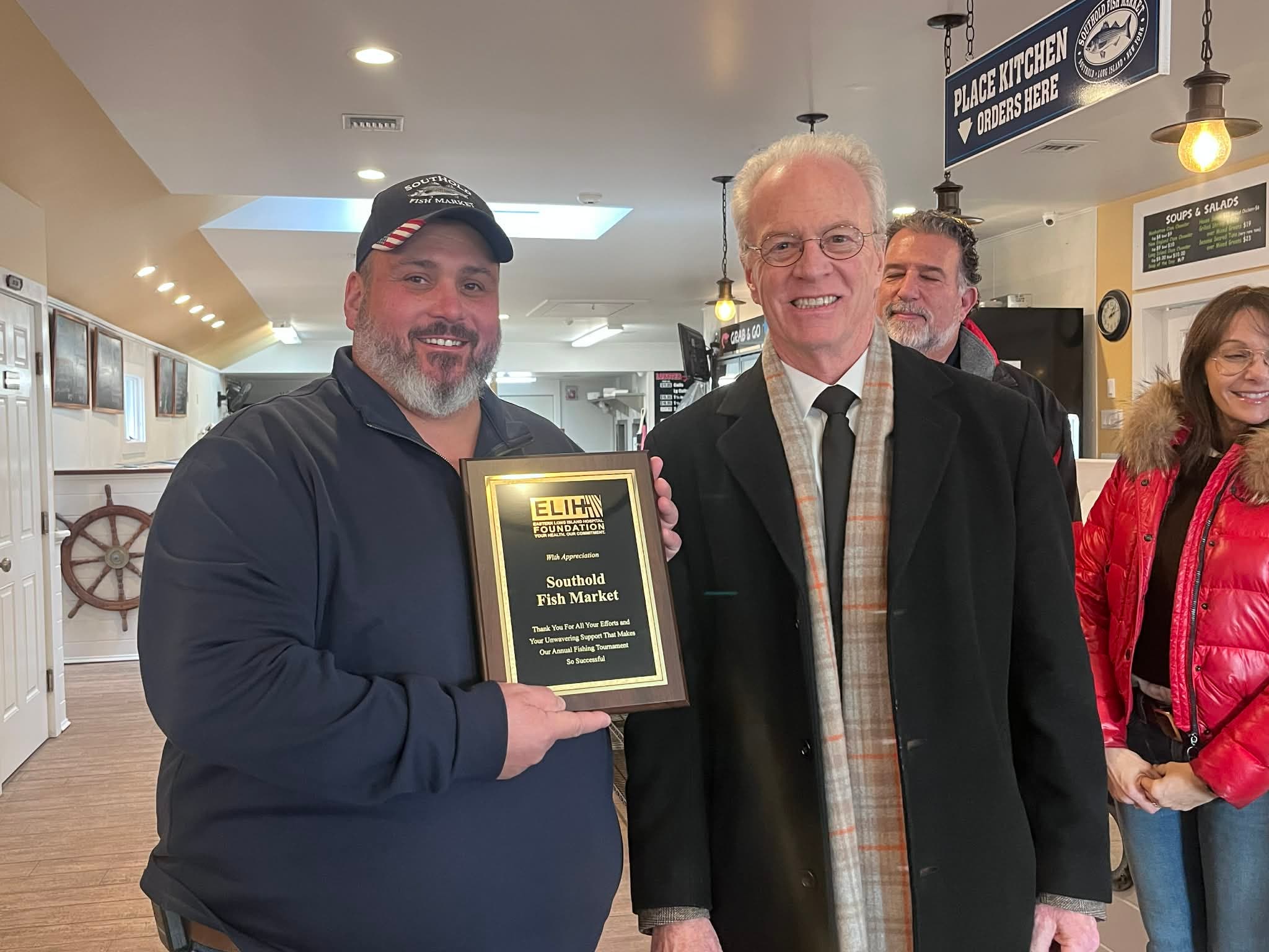 Community hero Charlie Manwaring of Southold Fish Market honored by ...