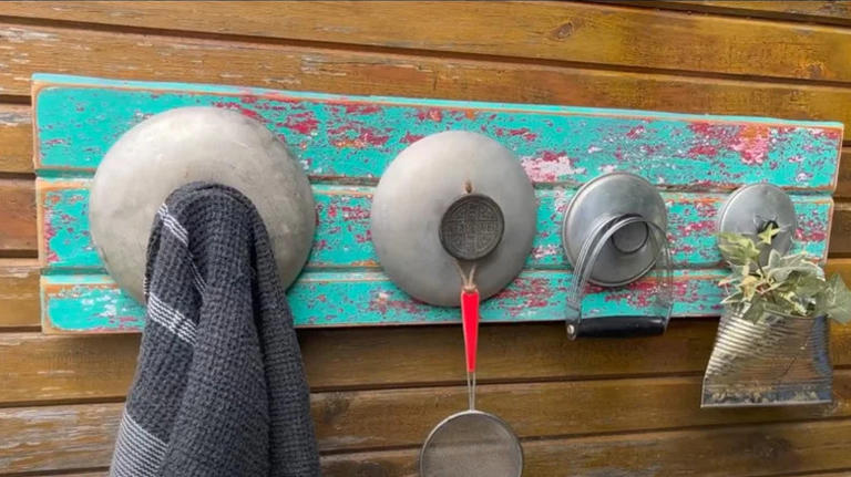 Repurpose old pot lids into charming kitchen decor that doubles as storage
