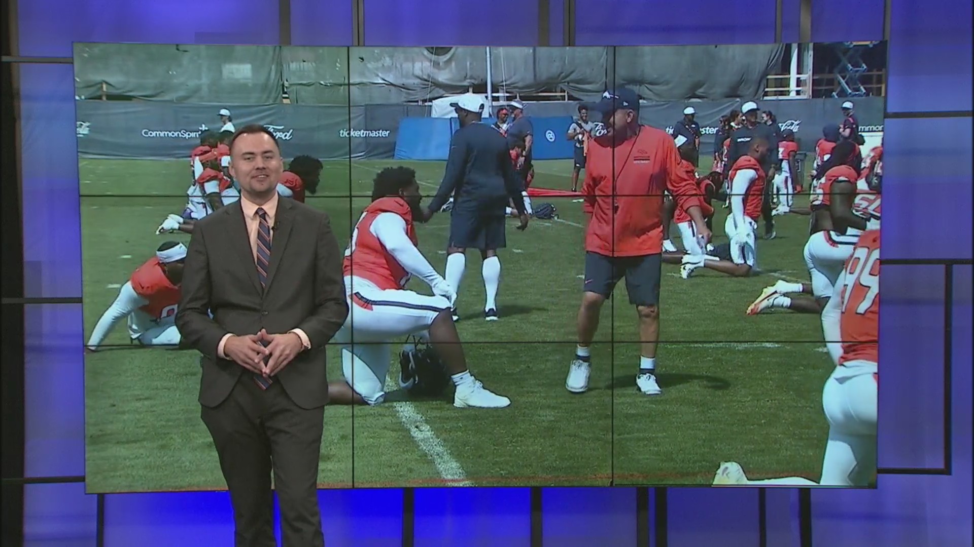 A bar divided: a Broncos server at a Bills bar