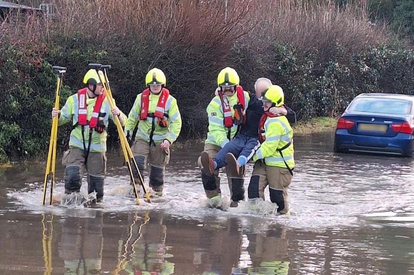 Man rescued from car after getting trapped in rising flood water