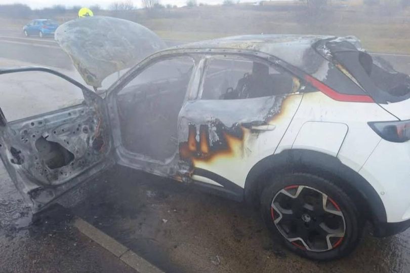 Baby pulled from burning car by passers-by as mum screams in horror