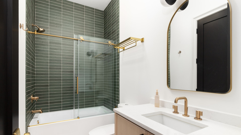 Goodbye to traditional tile showers: The moody bathroom trend taking over