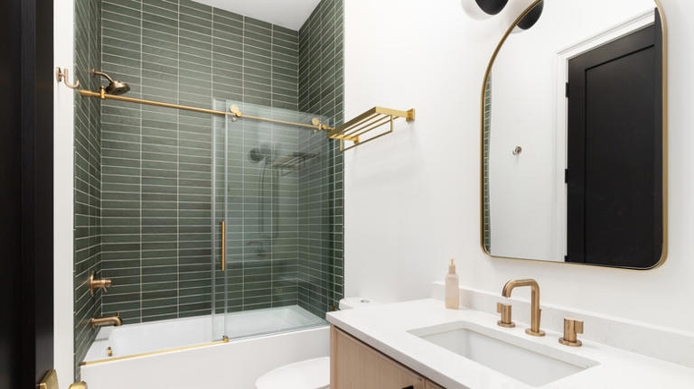 Goodbye to traditional tile showers: The moody bathroom trend taking over