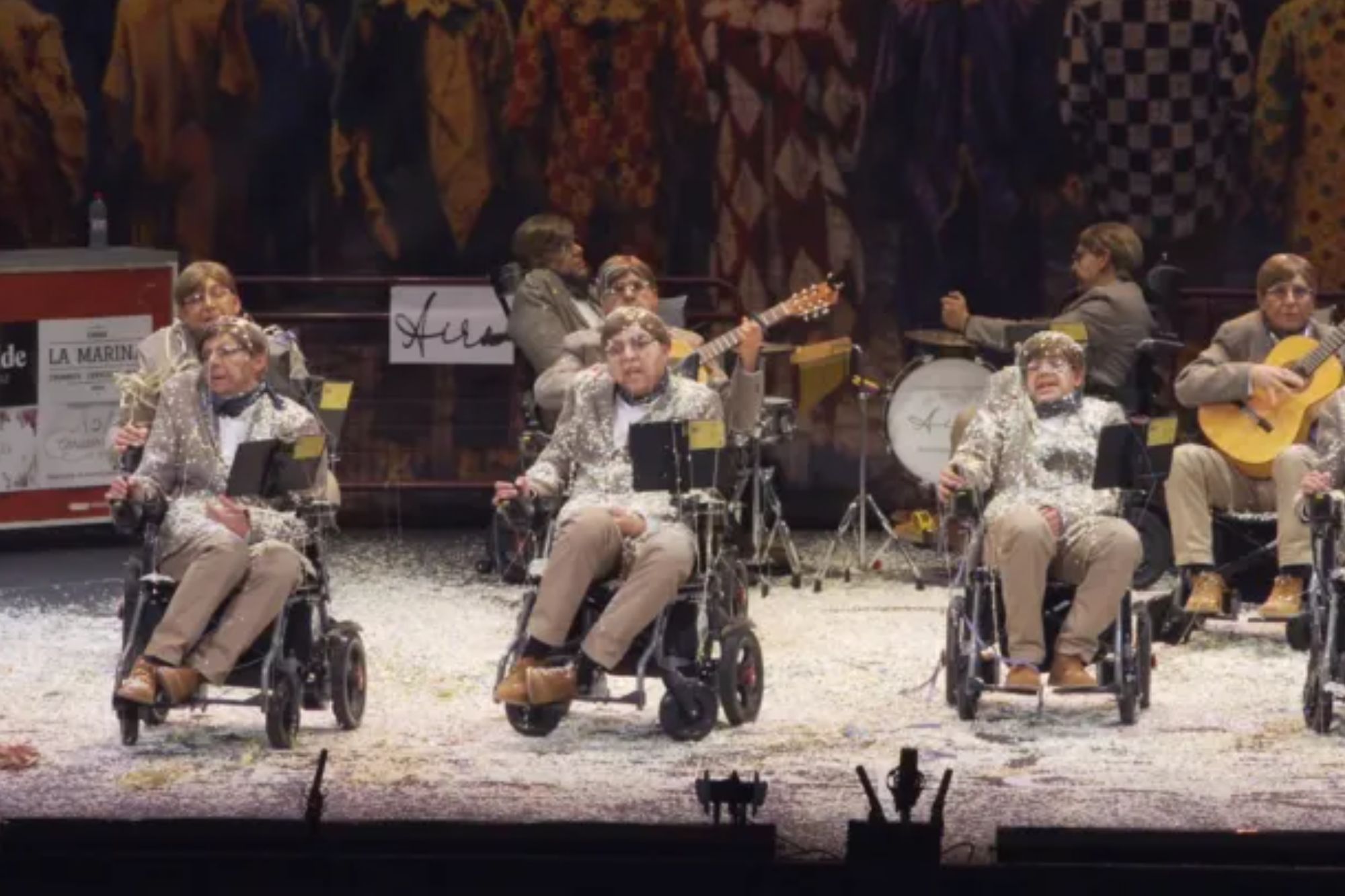 Spanish carnival group dress like Stephen Hawking, zip around in ...