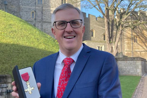 Reading climate scientist and educator receives OBE at castle ceremony