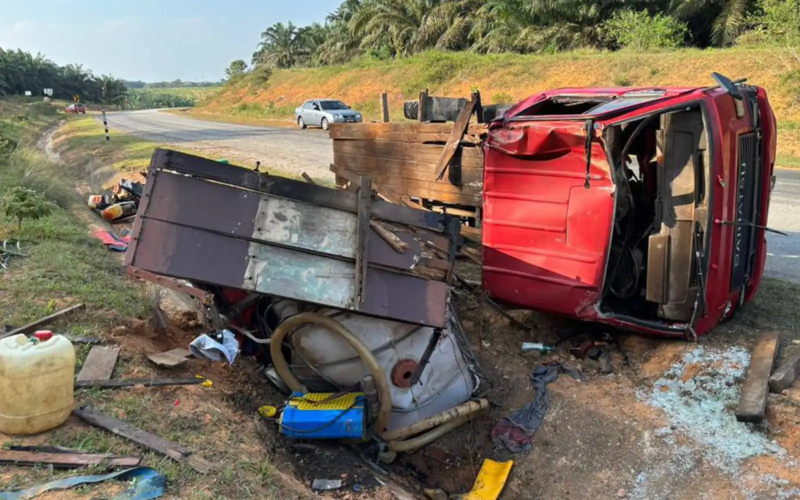 2 foreign workers killed as lorry overturns while overtaking