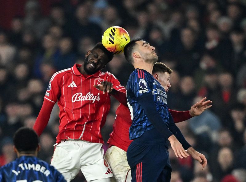 Soccer-Arsenal frustrated by feisty Forest but move seven points clear ...